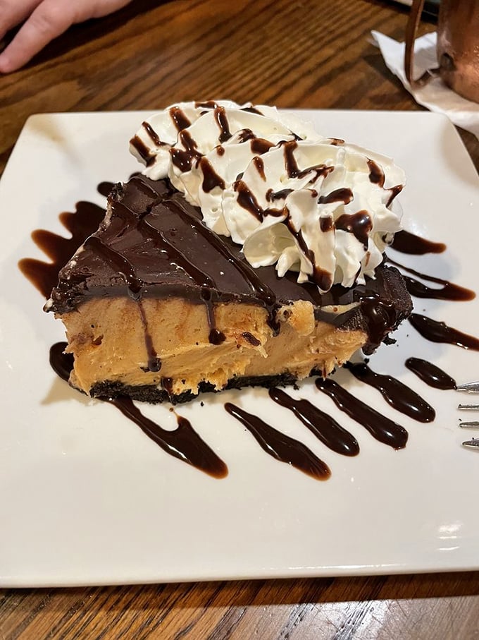 Peanut butter and chocolate, the dynamic duo of desserts! This slice of heaven is proof that sometimes, the best catch isn't seafood at all.