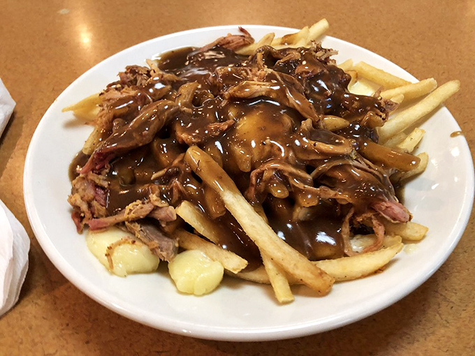 Poutine perfection! This Canadian cousin of loaded fries is bringing international flair to the heartland. Passport to flavor: granted!
