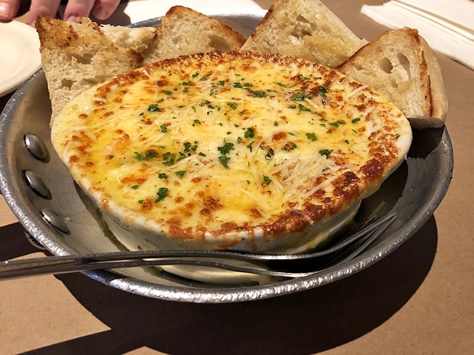 Shrimp cargot: escargot's seafaring cousin. Bubbling with cheese and garlic, it's a dish that proves everything's better with a French accent.