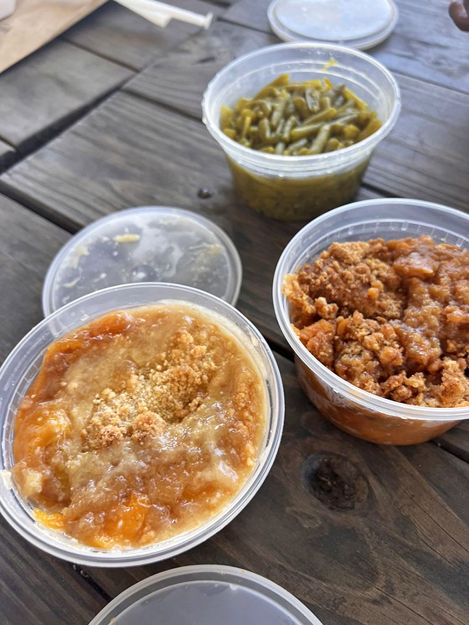 Takeout containers of Southern gold &ndash; proof that the only souvenir worth bringing home involves peach cobbler and no refrigeration required.