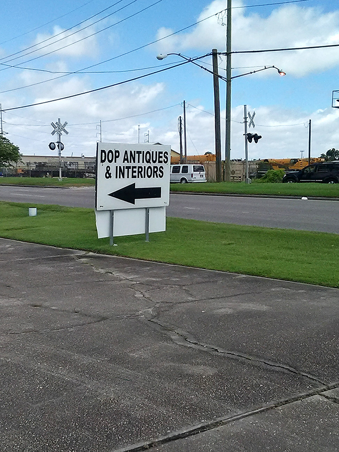 Follow the arrow to yesteryear! This unassuming sign points the way to a world where every object has a story to tell.