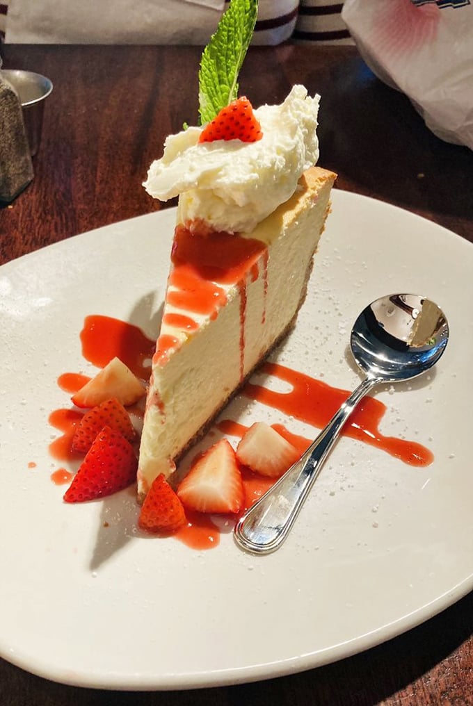 A slice of heaven, topped with a cloud! This strawberry cheesecake is so pretty, it belongs in a dessert art gallery.