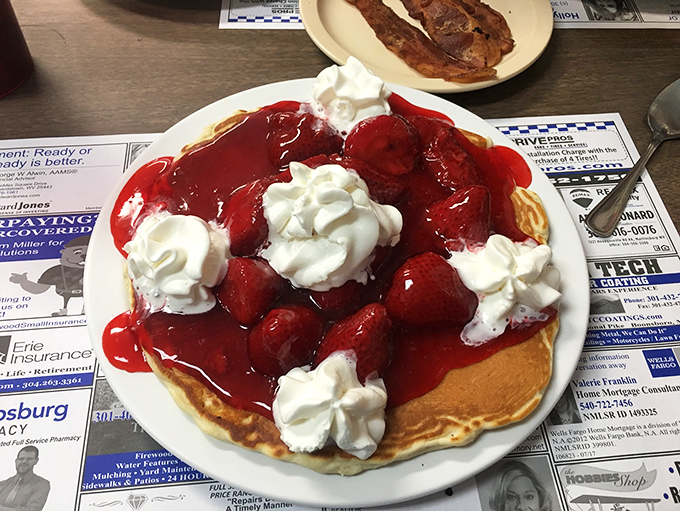 Strawberry fields forever? Nah, just until you finish these pancakes. It's a berry good morning at Betty's, where fruit meets fluff in perfect harmony.