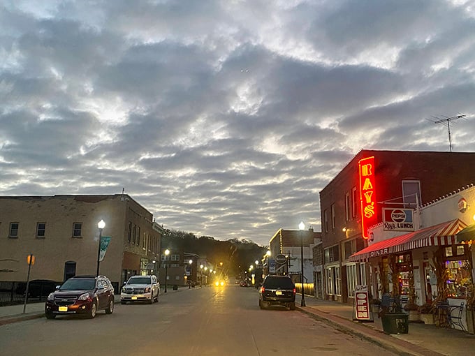 As dusk settles over Excelsior Springs, Ray's neon sign glows like a beacon, guiding hungry travelers to breakfast salvation since the Great Depression.