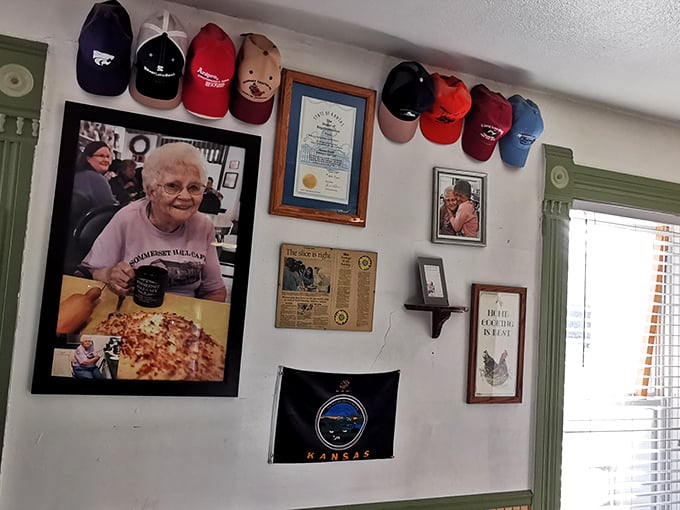 Wall of fame: This eclectic display is a tapestry of local history, customer memories, and enough baseball caps to outfit a little league team.