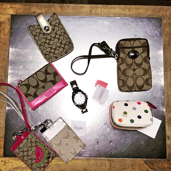 Coach and designer accessories clustered like old friends at a reunion, each with stories to tell and prices that won't make you wince.