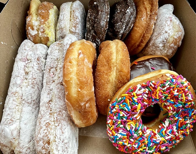 A dozen reasons to smile! This box of assorted donuts is like a greatest hits album for your taste buds, with every track a chart-topper.