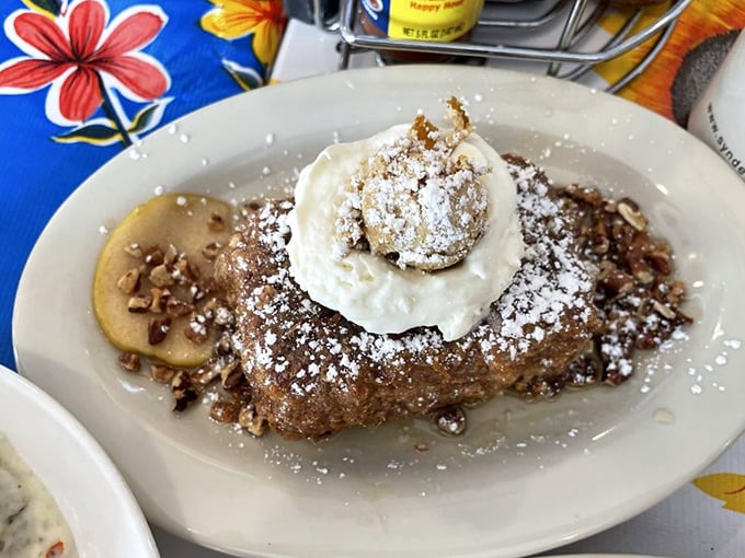 Banana bread gone wild! This sweet treat, topped with a dollop of cream and a sprinkle of nuts, is proof that sometimes the best things in life are a little messy and a lot delicious.