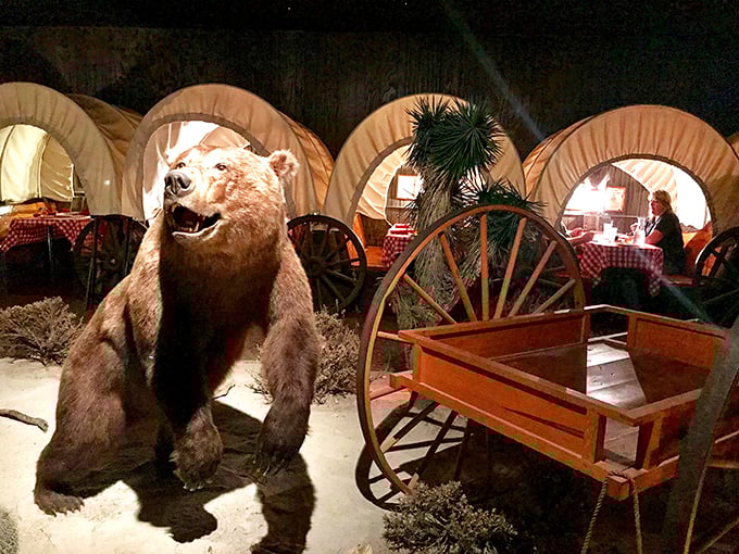 Unbearable cuteness! This bear statue's got more personality than Yogi and Boo-Boo combined. Don't feed the animals, folks!