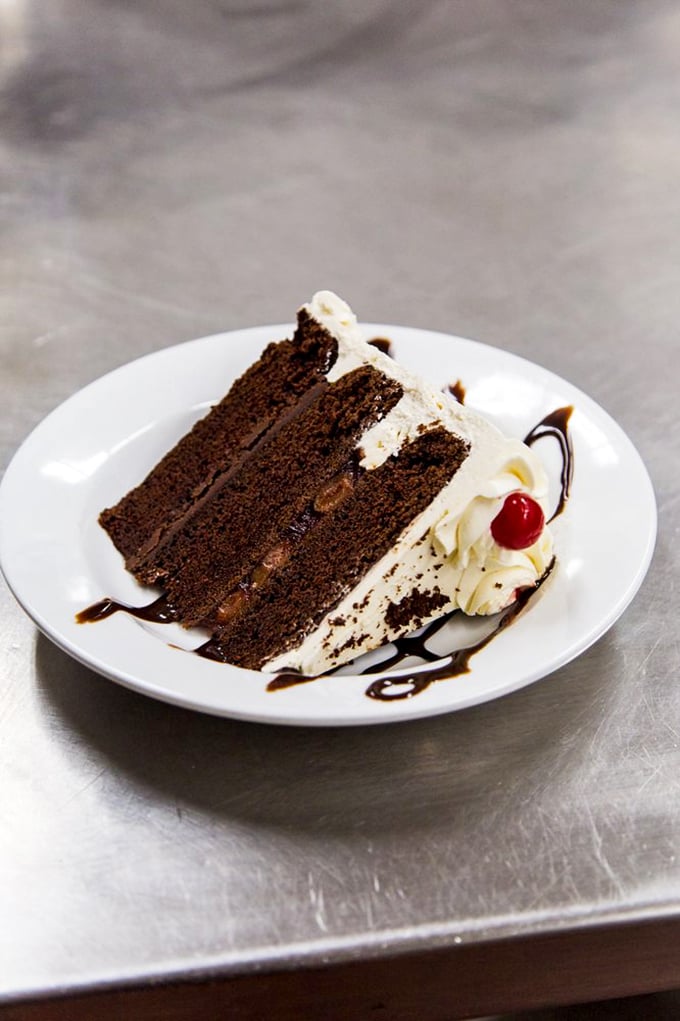 Chocoholics, rejoice! This cake isn't just dessert, it's a religious experience. Prepare for a sugar-induced epiphany with every bite.