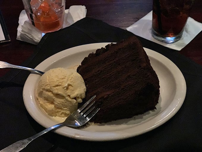 Chocolate cake so dark and decadent it should require a warning label, accompanied by vanilla ice cream for that perfect temperature tango.