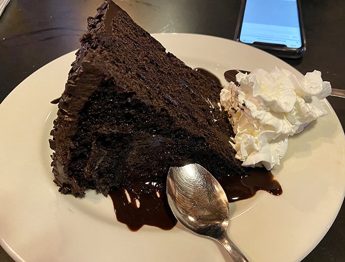 Houston, we have a problem… this chocolate cake is so rich, it might just buy the restaurant. Resistance is futile, so grab a fork and dive in!