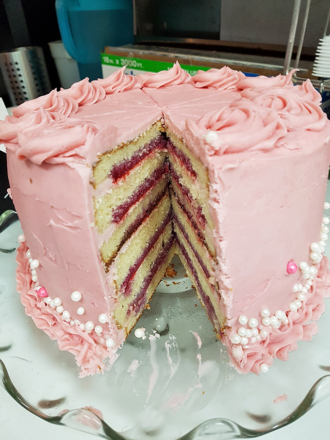 Behold, the pink palace of pastry perfection! This cake isn't just dessert, it's a statement piece that says, "Life's too short for boring sweets."