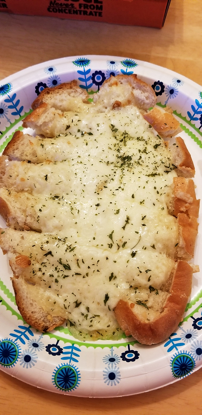 Cheesy garlic bread that's more comforting than a hug from grandma. It's the carb-loaded embrace you didn't know you needed.