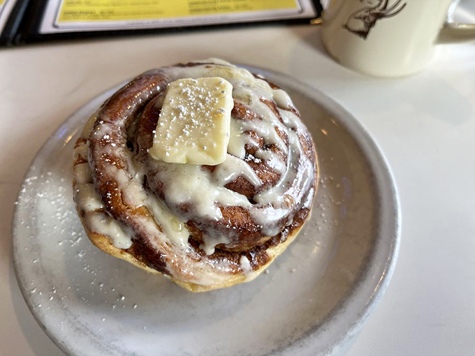 Cinnamon roll or edible pillow? This gooey masterpiece is so big, it comes with its own area code.