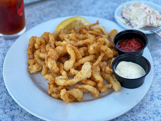 Fried clam strips: the unsung heroes of the seafood world. Crispy, tender, and begging for a squeeze of lemon.