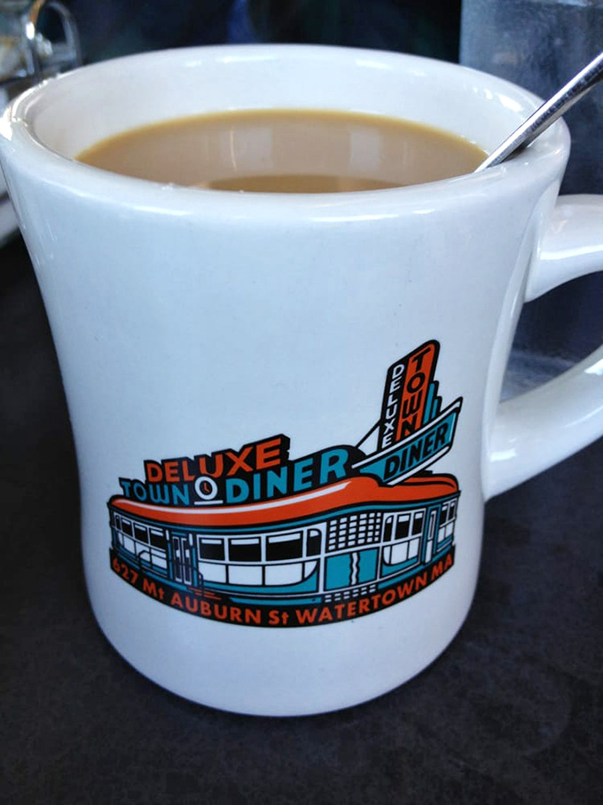 The diner's logo mug doesn't just hold coffee; it holds promises of refills, comfort, and the unofficial start to a great day.