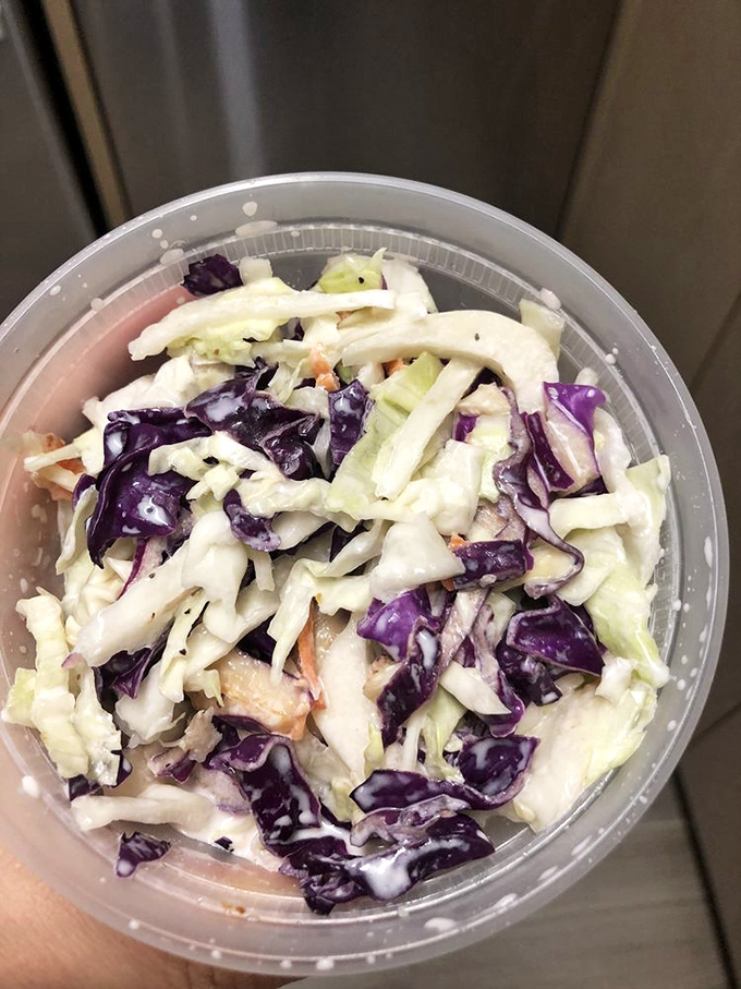 A rainbow in a bowl! This isn't just coleslaw; it's a crunchy, creamy carnival of flavors that puts the 'wow' in chow.