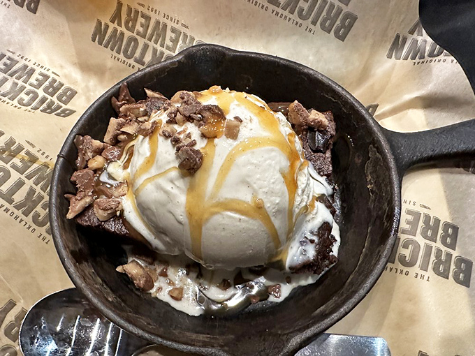 The Heath Bar Brownie arrives sizzling, crowned with ice cream and caramel. It's not dessert&mdash;it's performance art you can eat.