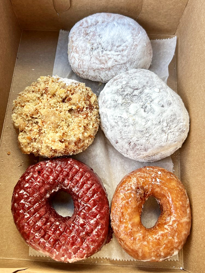 A box of happiness, sprinkled with joy! From classic glazed to powdered perfection, these donuts are like a party for your taste buds. Dive in, life's short!