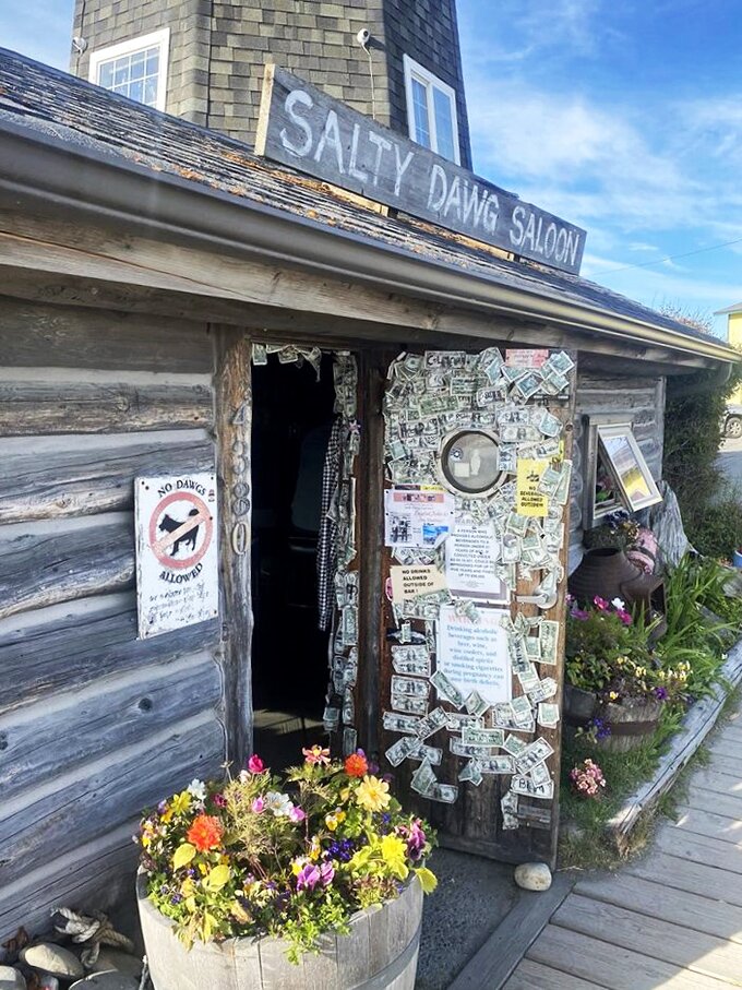 Welcome to the Salty Dawg, where even the entrance is decorated with more bills than a senator's pocket!