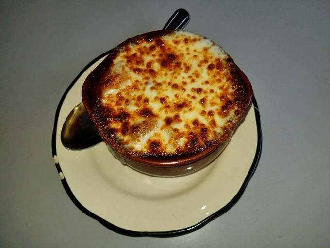 Cheese pull for the soul! This French onion soup, with its perfectly browned crust, is like a warm hug for your taste buds on a chilly New York day.
