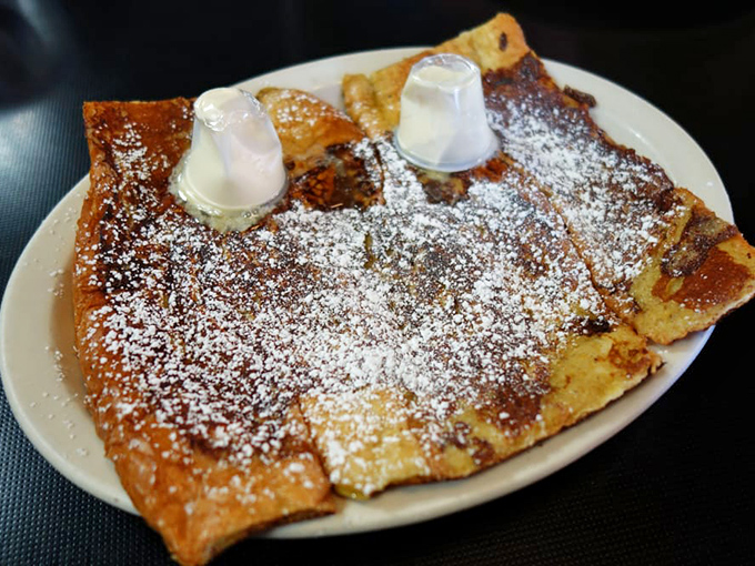 French toast that puts the "ooh la la" in breakfast. Dusted with powdered sugar, it's like a sweet snow day on your plate.