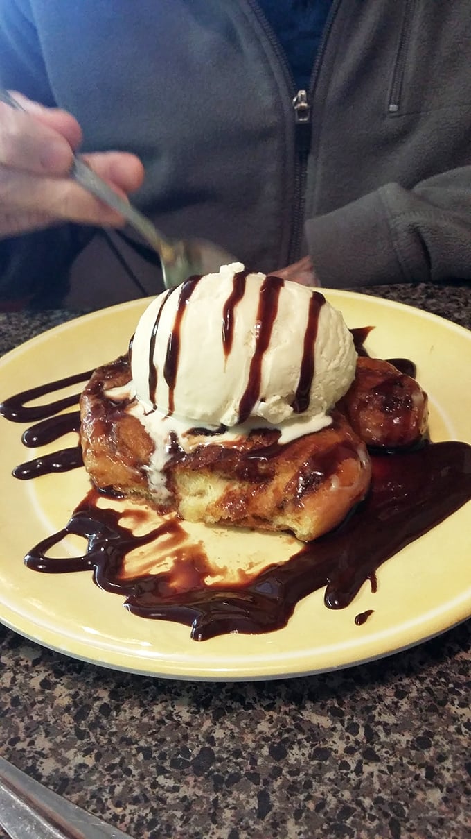 Dessert nirvana: a warm, grilled honey bun crowned with melting ice cream and chocolate drizzle&mdash;proof that sometimes the simplest pleasures are the most divine.