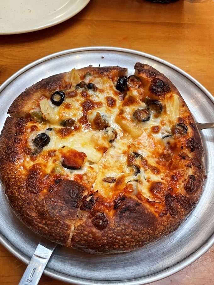 Behold, the hand-tossed masterpiece! With a perfectly blistered crust and gooey cheese, it's a work of art you can actually eat.