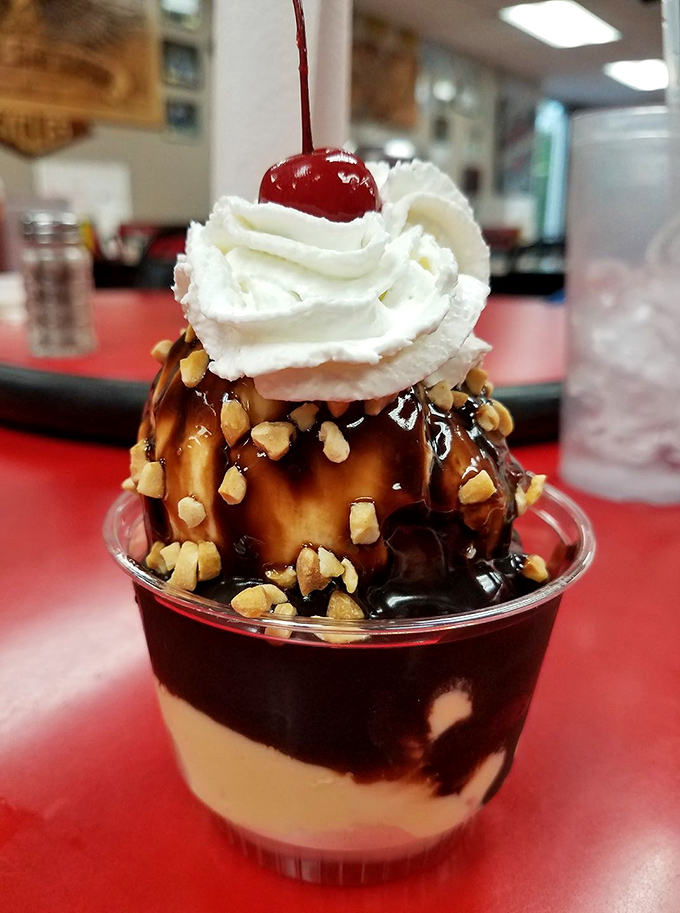 Not all heroes wear capes, but some wear cherries. This hot fudge sundae with whipped cream is the proper finale to any Sam's feast.