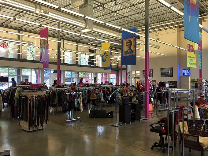 The grand expanse of possibility. High ceilings, colorful banners, and endless racks of potential treasures make this thrifter's paradise feel like a fashionable warehouse party.