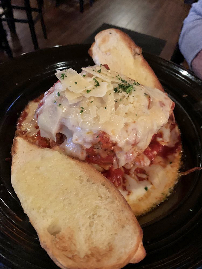 Lasagna or cheesy mountain of joy? Either way, it's a carb-lover's dream come true. Grab a fork and start climbing!