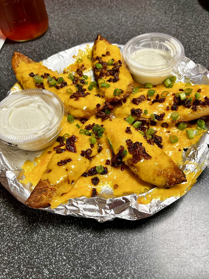 Loaded potato skins: where "a little indulgence" becomes "I regret nothing." Crispy, cheesy, and utterly irresistible.