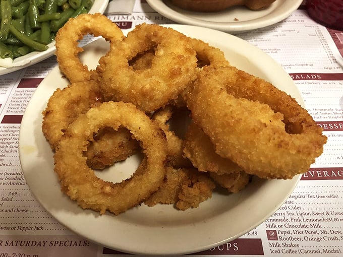 Onion rings stacked like golden halos, with a crunch so satisfying it makes you wonder why anyone bothered inventing fancy appetizers in the first place.