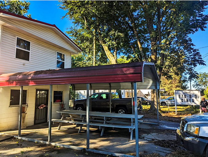 Rustic charm meets barbecue brilliance! This little diner might not look like much, but it's where flavor goes to party and your diet goes to die.