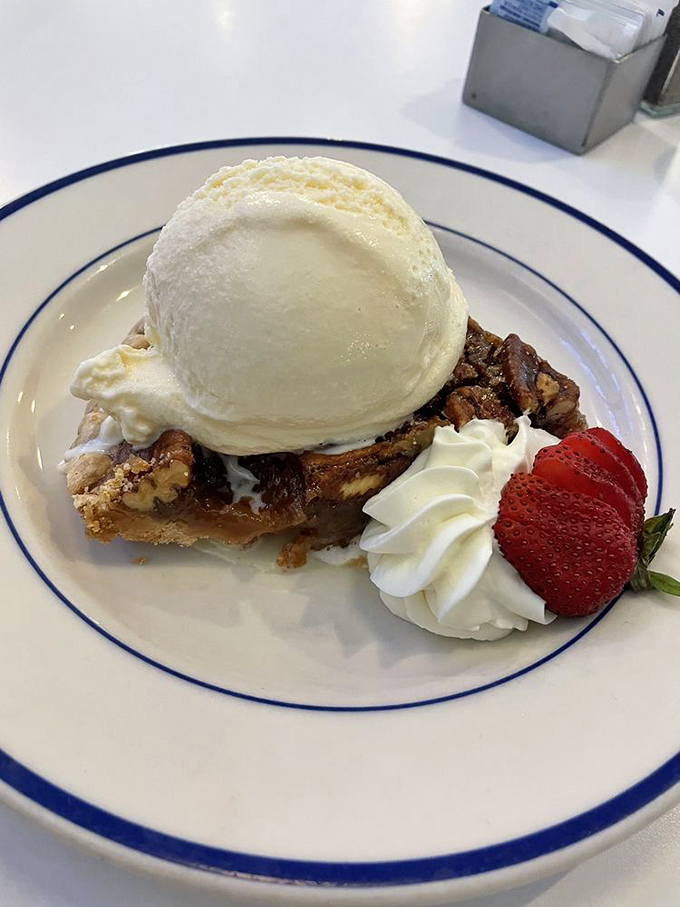 Pecan pie &agrave; la mode: Where Southern charm meets creamy dreams. A sweet finale that's hard to top.