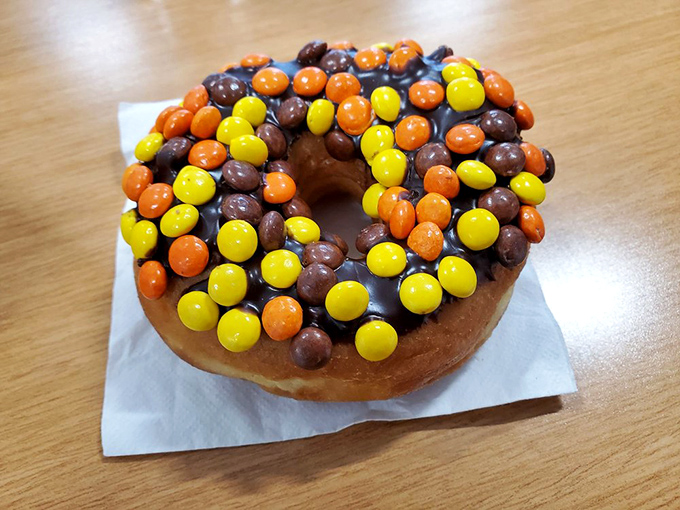 Peanut butter lovers, rejoice! This Reese's donut is a match made in confectionery heaven. It's like your childhood lunchbox grew up and got fancy.