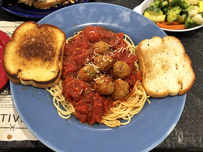 Spaghetti and meatballs: the superhero duo of comfort food. This plate's got more Italian flair than a Vespa convention in Rome.