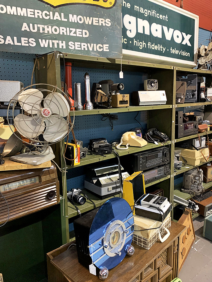 Vintage tech paradise! From rotary phones to boomboxes, this shelf is a testament to how far we've come (and how cool we used to look).