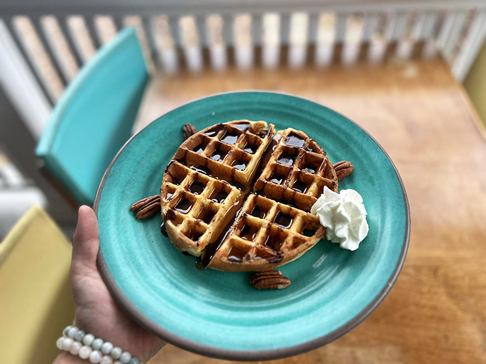Waffles: nature's way of saying syrup needs a home. Golden, crispy, and ready to make your taste buds do the happy dance.