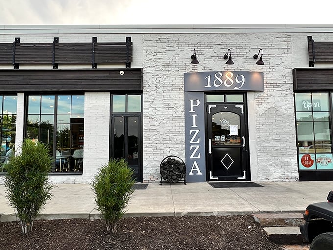 The sleek white stone facade of 1889 Pizza Napoletana promises Neapolitan perfection hiding behind that unassuming door.