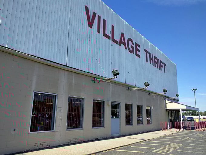 Welcome to bargain paradise! Village Thrift's massive white facade promises treasures within, like a modern-day Ali Baba's cave for the frugal adventurer.