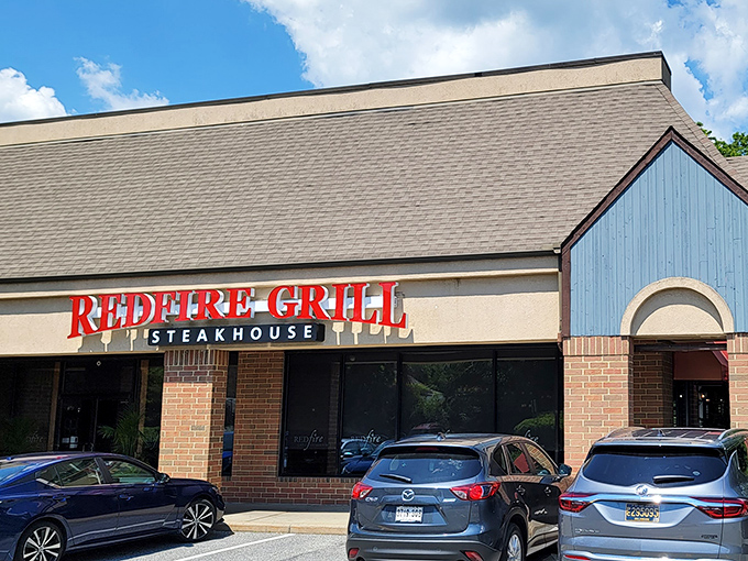 Redfire Grill: Where steak dreams come true! This cozy exterior promises a warm welcome and sizzling delights inside.
