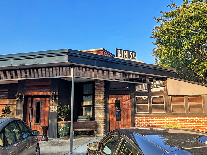 Step into Bin 54 and feel the vibe change. It's like walking into a jazz club, but instead of music, steak is the headliner.