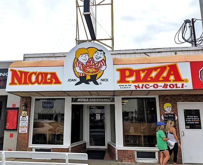 Like finding an old friend at the beach, Nicola's storefront welcomes you with cartoon charm and the promise of pizza perfection.
