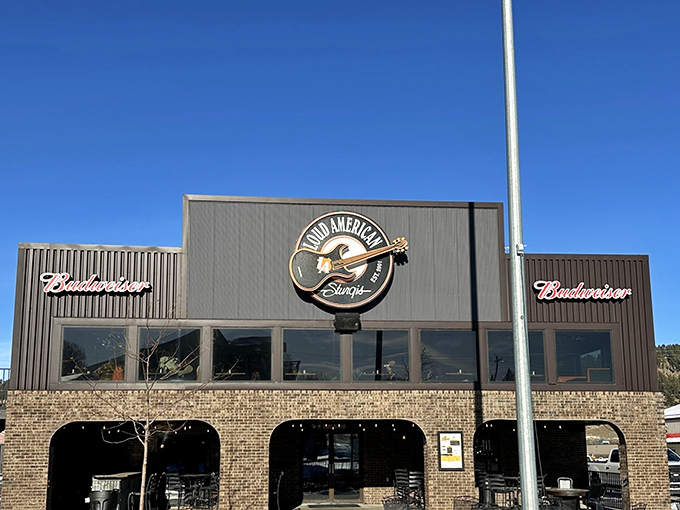 Budweiser signs and brick walls set the stage for a culinary concert. This roadhouse serves up Americana with a side of attitude.