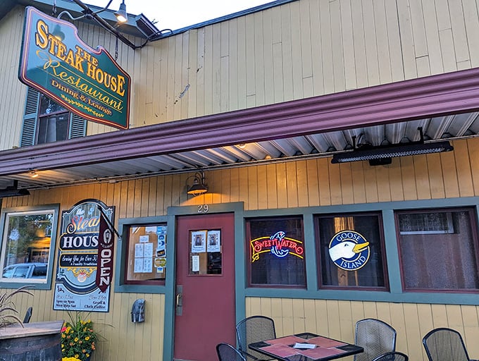 Rustic barrels and blooming flowers set the stage. Inside, the aroma of sizzling steaks promises a meal worth writing home about.