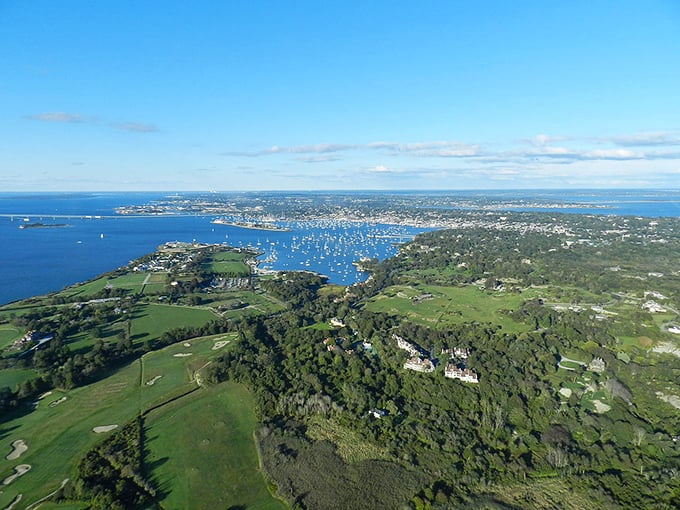 "Who needs a drone when you've got this view?" Newport's coastline unfurls like nature's own masterpiece, dotted with sailboats that look like confetti on the water.