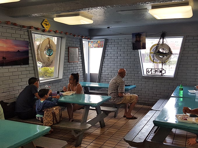 Surf's up on the walls, and flavor's up on the tables! This cozy dining area serves up island vibes with a side of aloha.