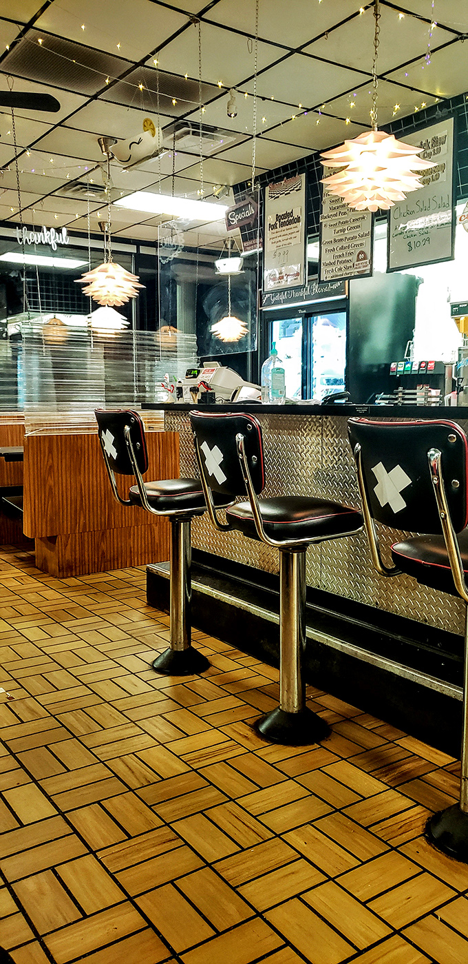 Step into a time machine of taste! This cozy interior, with its twinkling lights and classic counter, sets the stage for culinary nostalgia.